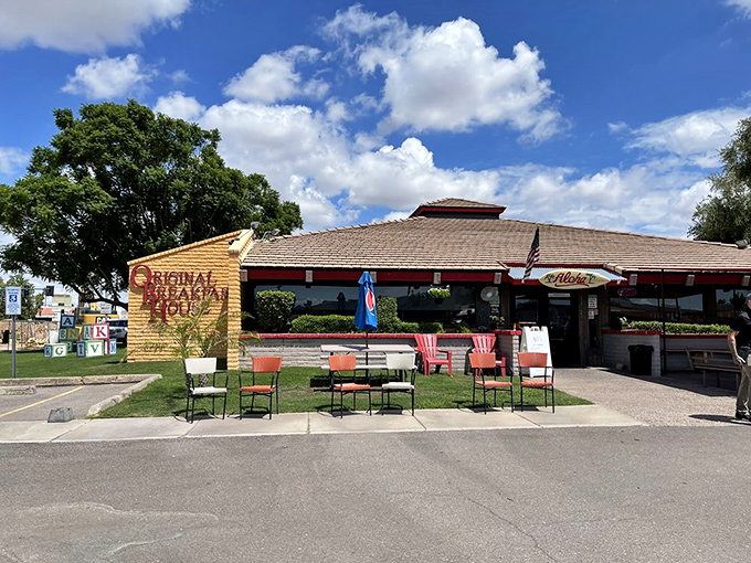 The sunshine-yellow exterior with its cheerful red trim promises what every breakfast lover seeks: a place where calories don't count before noon.