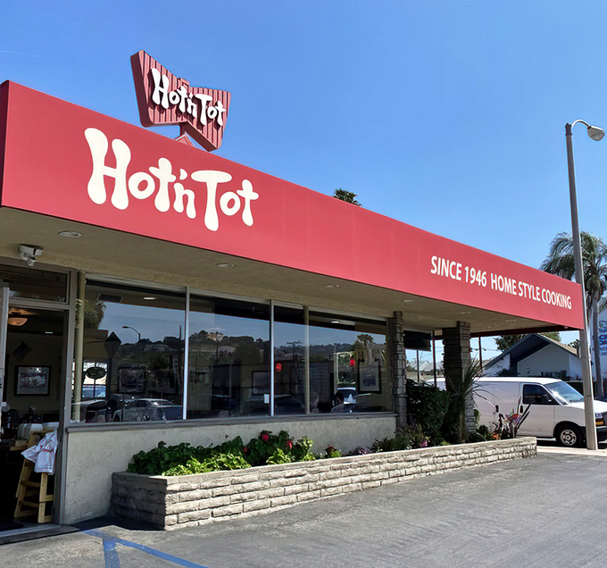 That iconic red awning is like a beacon of breakfast hope on Pacific Coast Highway. Classic diner architecture at its finest.
