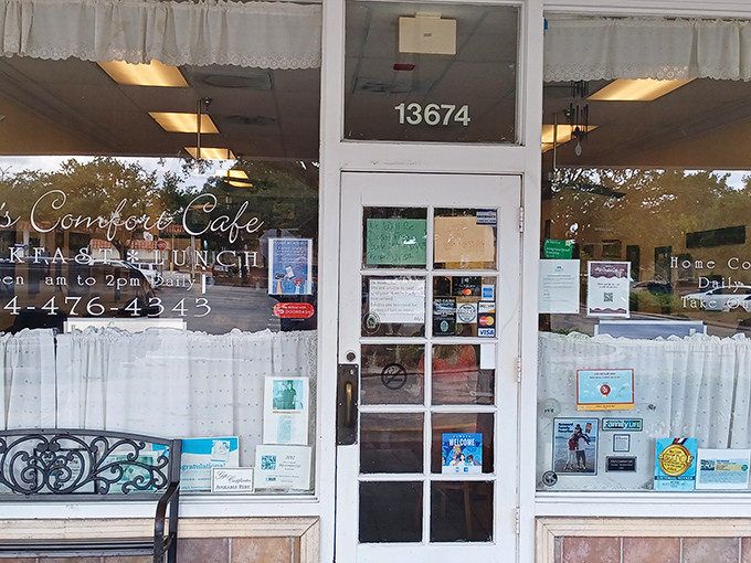 The unassuming storefront of Ally's Comfort Cafe, where lace curtains and a simple sign hide culinary treasures that would make any food pilgrim rejoice.