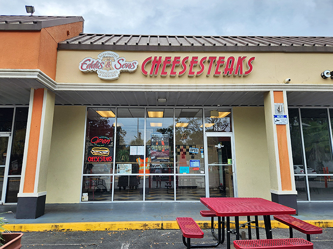 The storefront beckons like a lighthouse for hungry souls, with that bold red "CHEESESTEAKS" sign promising delicious salvation in Jacksonville's Southpoint Plaza.