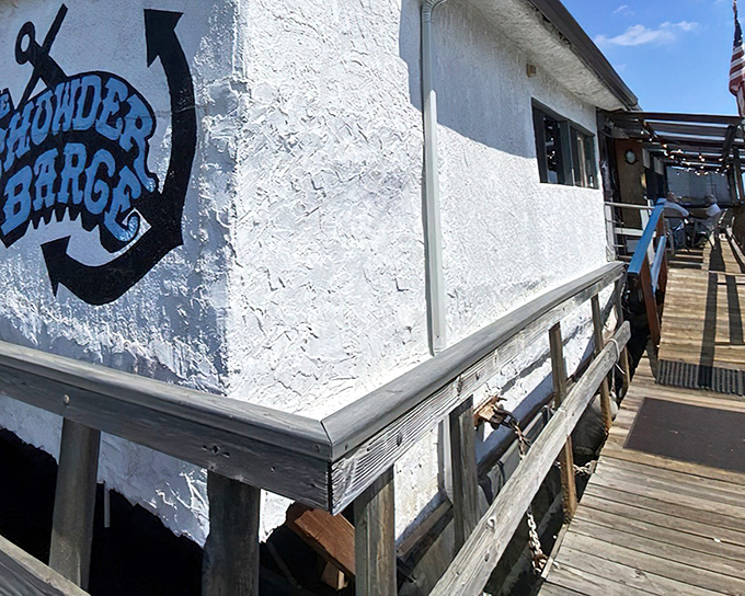 The floating charm of Chowder Barge welcomes seafood lovers with weathered wooden planks and American flag&mdash;nautical dining that actually bobs with the tide.