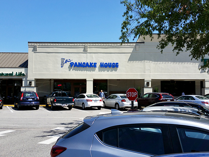 The blue sign beckons like a breakfast lighthouse, guiding hungry souls to pancake paradise in Columbia's bustling shopping center.