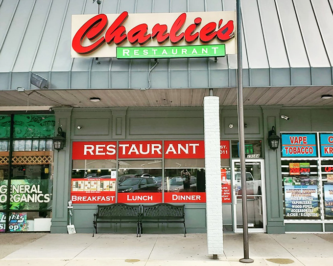 The iconic red Charlie's sign beckons hungry travelers like a lighthouse for the famished. Classic diner charm with zero pretension.