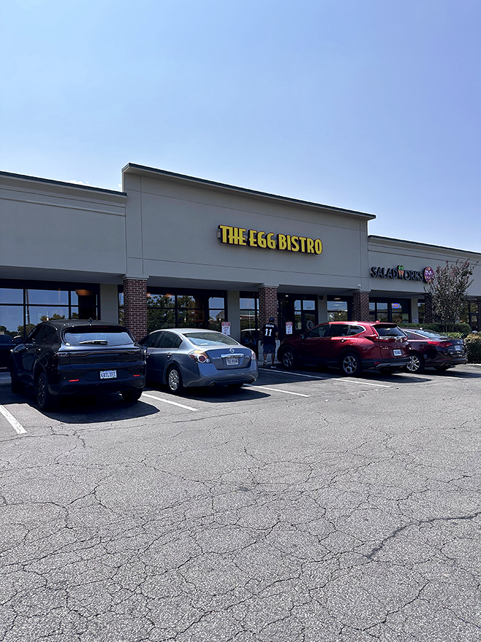 The bright yellow sign beckons like a breakfast lighthouse in a sea of strip mall sameness. Morning salvation awaits inside.