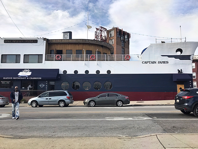 The ultimate maritime mirage: a full-sized ship permanently docked on Boston Street, proving Baltimore's seafood scene has officially gone overboard.
