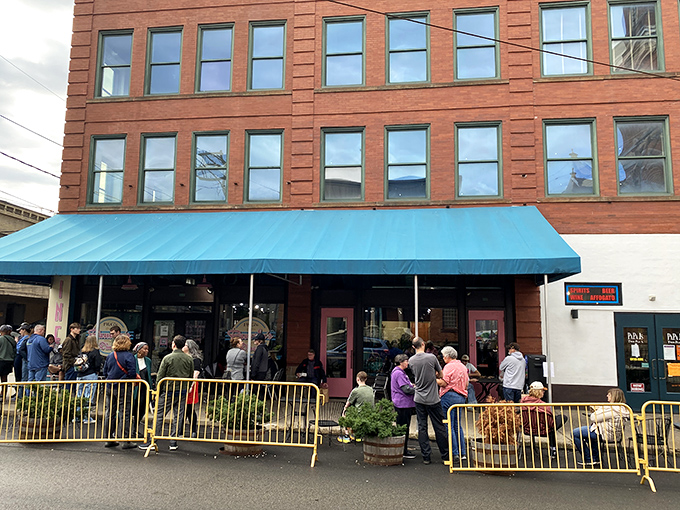 The iconic blue awning of Pamela's Diner in Pittsburgh's Strip District stands as a beacon for breakfast pilgrims seeking crepe-style enlightenment.
