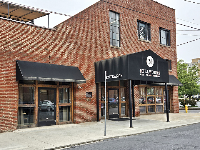 The brick facade of The Millworks stands proudly in Harrisburg, a testament to Pennsylvania's industrial past reimagined for our culinary present.