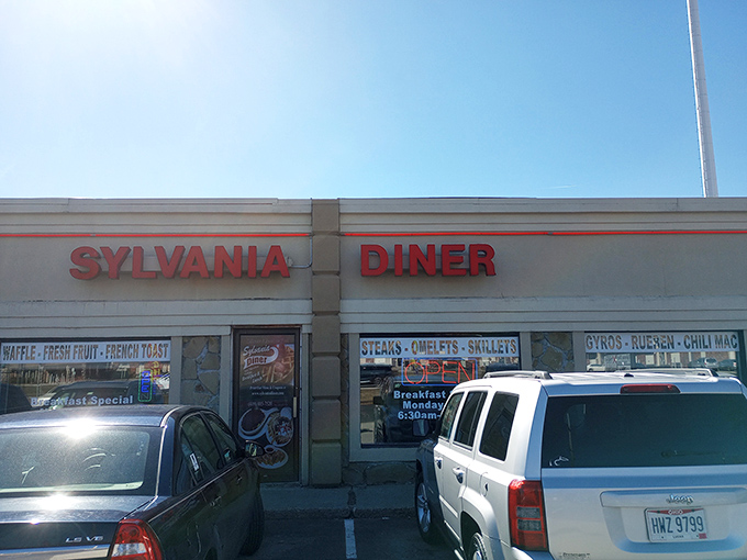 The iconic red sign of Sylvania Diner glows like a beacon for hungry travelers, promising comfort food salvation in suburban Ohio.