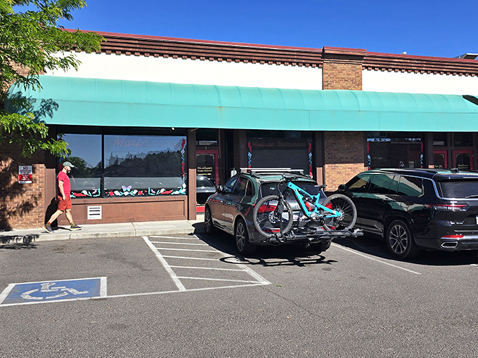 That turquoise awning beckons like a beacon of burrito bliss in downtown Flagstaff's charming streetscape. 