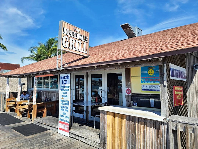 The weathered wooden exterior of Boardwalk Grill screams "authentic Florida seafood joint" louder than a seagull eyeing your lunch. 