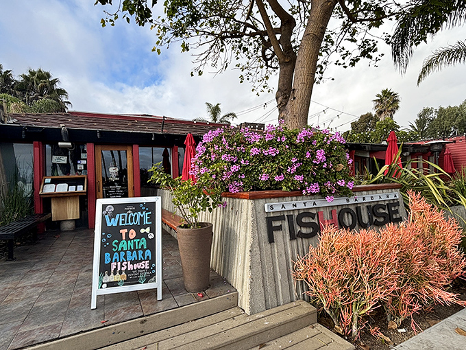 A coastal welcome that feels like a warm hug &ndash; vibrant bougainvillea frames the entrance to Santa Barbara FisHouse, where seafood dreams come true.