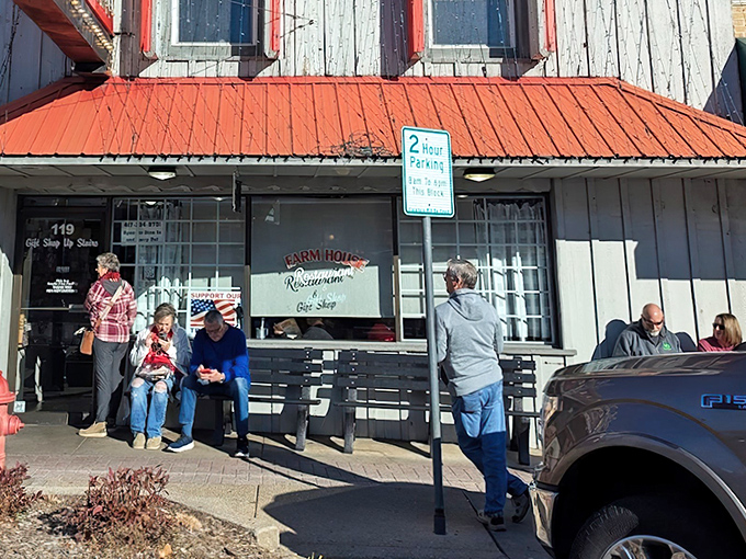 The unassuming exterior with its weathered siding and bright red roof promises something authentic – a culinary hideaway where locals gather and tourists stumble upon greatness.