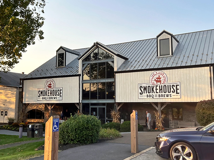 Barn-inspired architecture meets barbecue paradise. The Smokehouse's welcoming exterior promises smoky treasures within, standing proudly against Pennsylvania's blue skies.