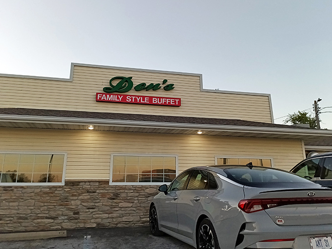 The unassuming exterior of Don's Family Style Buffet, where those vibrant red flowers aren't just decoration&mdash;they're your first clue that someone here cares about the details.