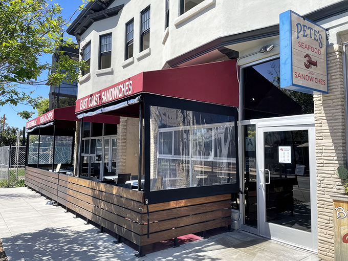 Pete's iconic red awning beckons seafood lovers like a lighthouse guiding hungry sailors home. The outdoor seating practically whispers "sit here and watch the world go by."