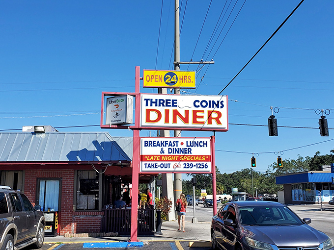 The iconic pink-trimmed sign beckons like a neon promise of comfort food nirvana. Three Coins Diner stands proudly as a 24-hour beacon for hungry Tampanians.