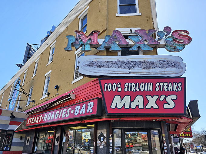The iconic yellow and red fa&ccedil;ade of Max's Steaks stands as a beacon of culinary authenticity on North Broad Street, promising Philadelphia's ultimate comfort food experience.