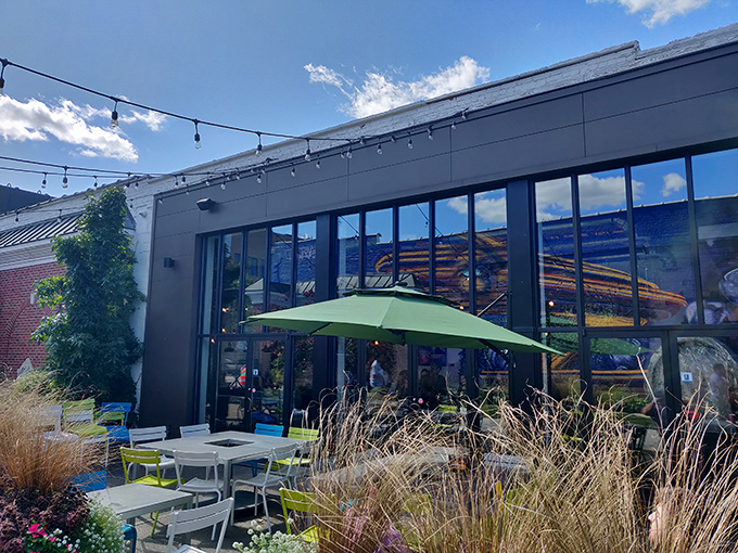 The sleek exterior of Brome Modern Eatery stands like a culinary beacon in Dearborn, promising burger nirvana behind those glass doors.
