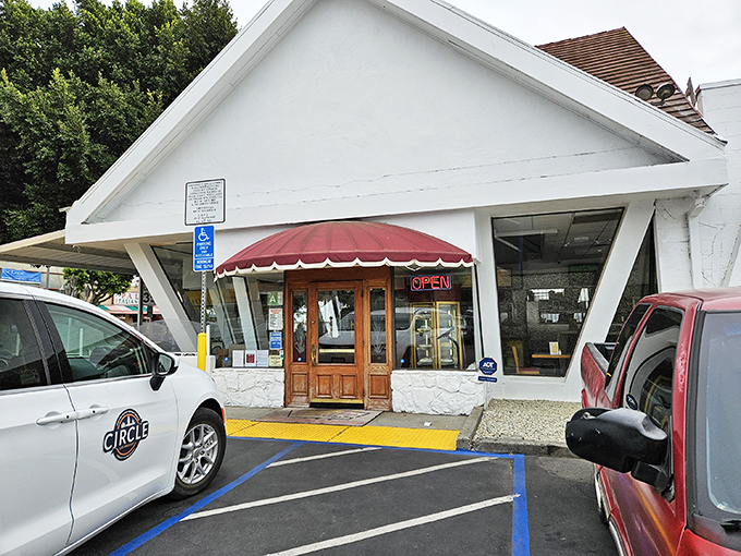 The iconic A-frame roof of House of Pies stands like a beacon of comfort on Los Feliz Boulevard, promising sweet salvation to weary Angelenos 24/7.