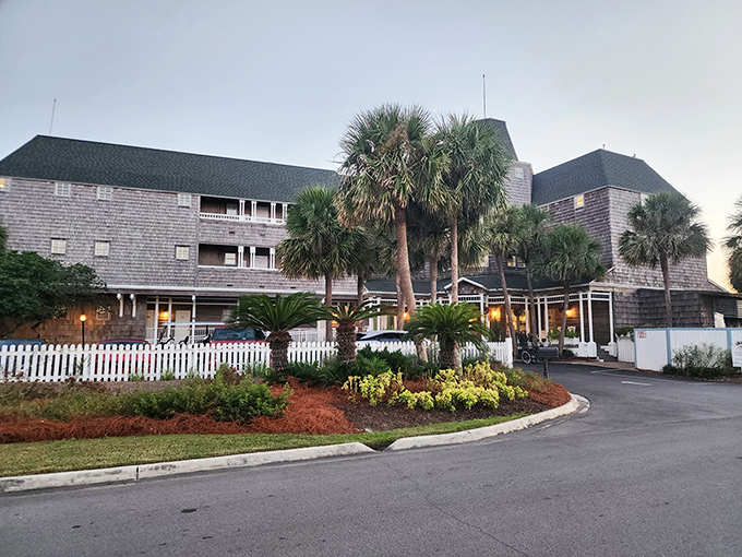 The Henderson Park Inn's weathered shingles and swaying palms create the perfect coastal disguise for Beach Walk Cafe's culinary treasures hiding within.