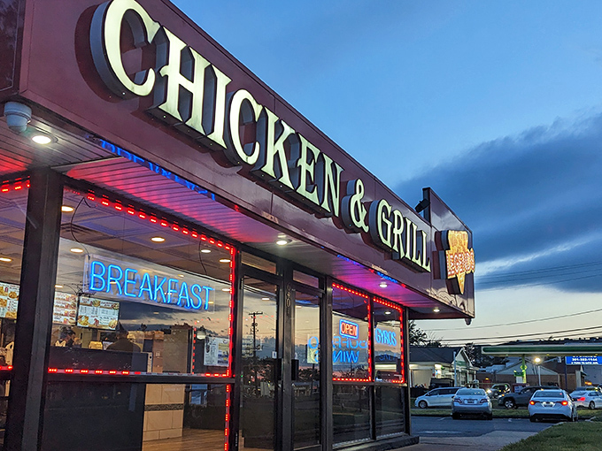 The bright red awning of Legends Chicken & Grill stands out like a culinary lighthouse, beckoning hungry travelers with promises of crispy delights within.