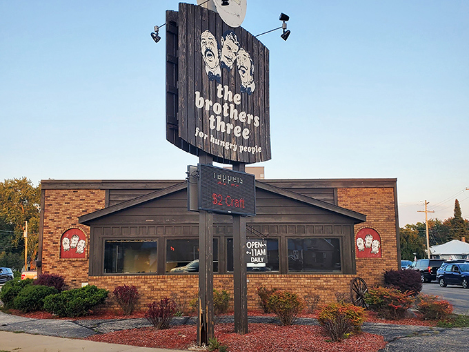 The unassuming exterior of Brothers Three might not scream "culinary destination," but that vintage sign promises what every hungry traveler seeks: satisfaction for hungry people.