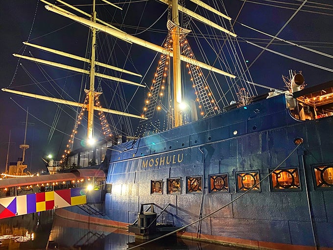 The Moshulu's illuminated masts pierce the night sky, a maritime giant transformed into Philadelphia's most dramatic dining destination. Dinner and a show, nautical style.