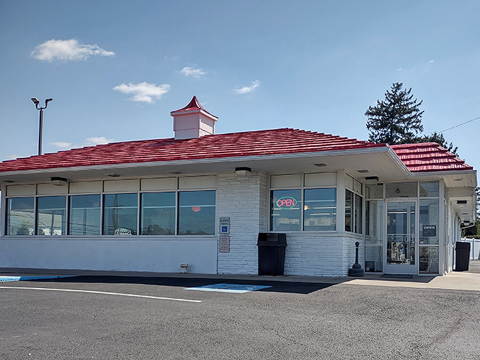 Speck's iconic red roof and vintage sign stand as a beacon of hope for the hungry traveler. Some architectural wonders house priceless art; this one houses priceless chicken.