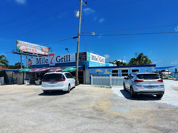 The iconic blue and white facade of Mile 7 Grill stands proudly along the Overseas Highway, a beacon for hungry travelers and locals alike.