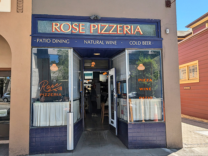 The unassuming blue-trimmed storefront of Rose Pizzeria might not scream for attention, but trust me&mdash;pizza paradise awaits behind that modest fa&ccedil;ade.
