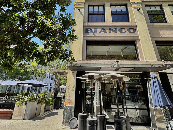 Pizzeria Bianco's ROW DTLA location brings architectural charm to industrial chic. The historic building's facade invites pizza pilgrims with understated elegance.