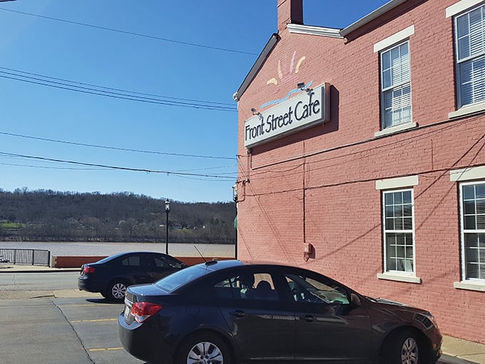 The pink landmark that promises culinary delight! Front Street Caf&eacute;'s vibrant exterior stands proudly along the Ohio River, beckoning hungry travelers with unmistakable charm.
