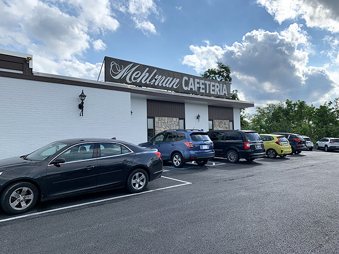 The unassuming white exterior of Mehlman's Cafeteria stands like a culinary time capsule, promising comfort food treasures that no trendy bistro could match.