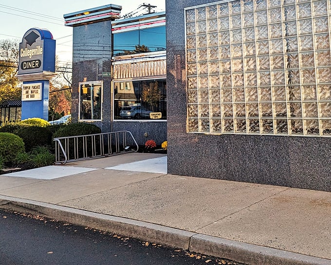 The distinctive blue-gray exterior of Collegeville Diner stands like a beacon for hungry travelers, promising comfort food salvation behind those welcoming double doors.