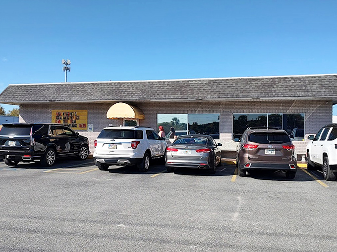 The unassuming brick exterior with its cheerful yellow awning is like a beacon for breakfast lovers. No fancy frills needed when the food speaks volumes.
