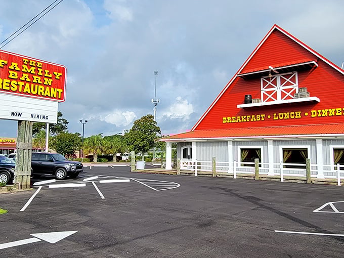 The iconic red barn-shaped building stands proudly against a blue sky, promising comfort food that feels like coming home.