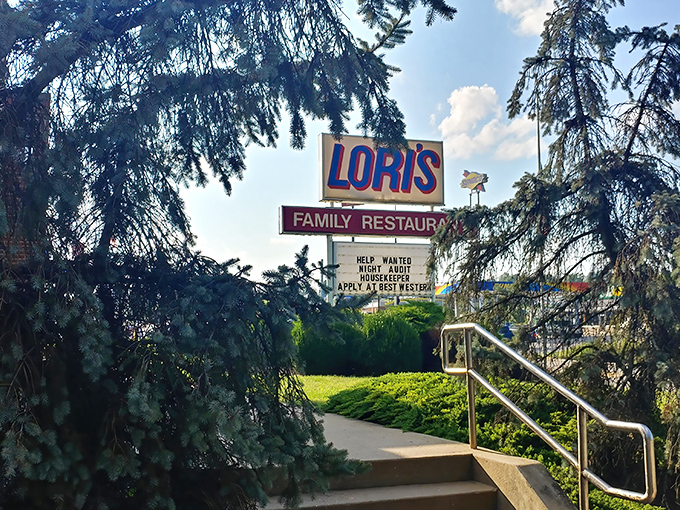 The classic roadside sign for Lori's Family Restaurant stands tall against Ohio's blue skies, promising homestyle comfort that's worth pulling over for.