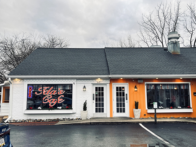 The bright orange accent wall and neon sign of Ida's Cafe beckon like a breakfast lighthouse on Lancaster's culinary shoreline.