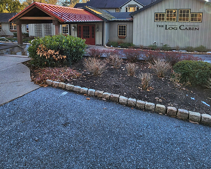 The unassuming exterior of The Log Cabin belies the culinary treasures within—like finding a Michelin star hiding in your grandmother's kitchen.