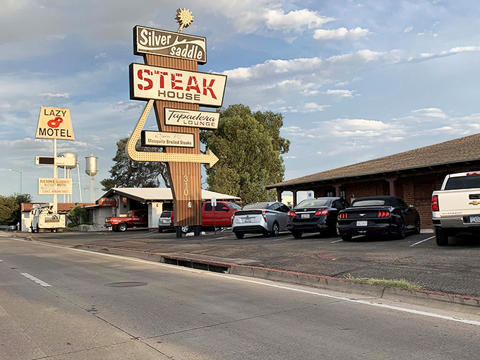 That vintage sign isn't just advertising &ndash; it's a time machine to when steakhouses were landmarks, not afterthoughts. The Silver Saddle stands proud against the Arizona sky.
