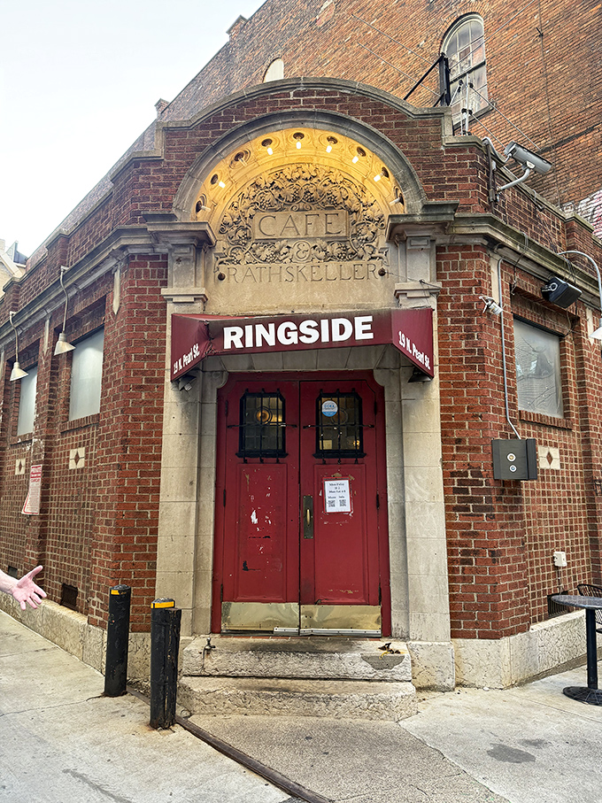 The historic brick fa&ccedil;ade of Ringside Caf&eacute; beckons with its distinctive red doors and vintage "RATHSKELLER" inscription&mdash;a Columbus landmark hiding culinary treasures within.