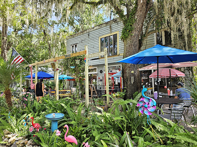 The mint-green exterior with its vibrant red door isn't just inviting&mdash;it's practically shouting "Get in here and eat something delicious!" through the Spanish moss.
