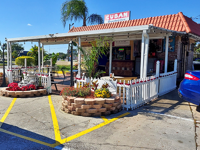 The humble kingdom of Cuban sandwich perfection stands unassumingly under Florida's brilliant blue skies, proving paradise doesn't always require an admission ticket.