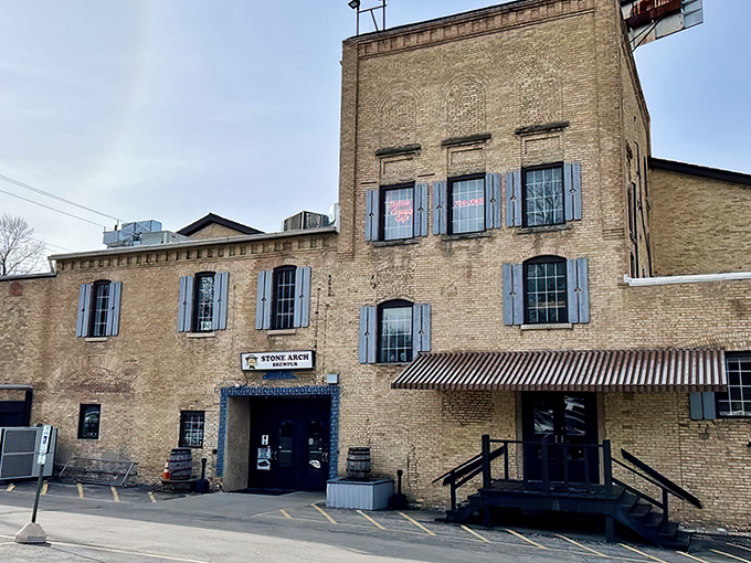 Stone Arch Brewpub's historic brick exterior stands proudly in Appleton, those blue shutters like a wink saying, "Yes, we've got stories to tell and brews to share."