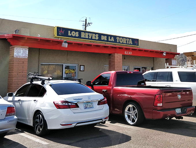 The unassuming exterior of Los Reyes de la Torta hides culinary treasures within. Like all great food adventures, this one begins with a humble storefront.