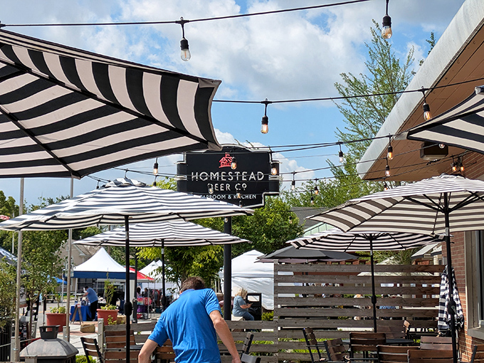 The patio at Homestead beckons with its striped umbrellas and string lights&mdash;a perfect spot for summer evenings when Ohio decides to behave weather-wise. 