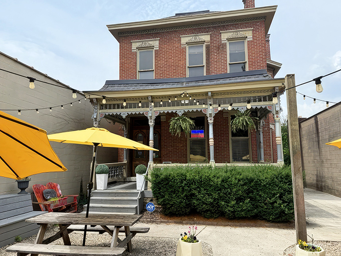 Victorian charm meets barbecue brilliance in this historic brick building. The yellow umbrellas practically scream, "Come get happy on our patio!"
