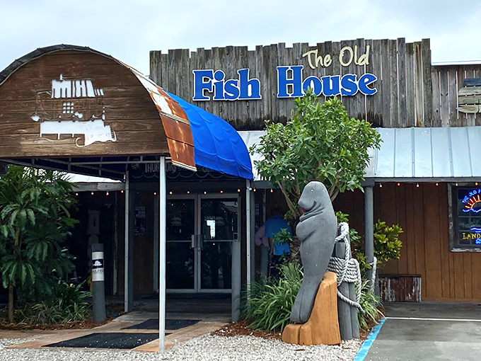 The weathered wooden exterior and giant fish sculpture aren't trying to be Instagram-bait&mdash;they're authentic Florida fish camp charm that says "the real deal awaits inside."