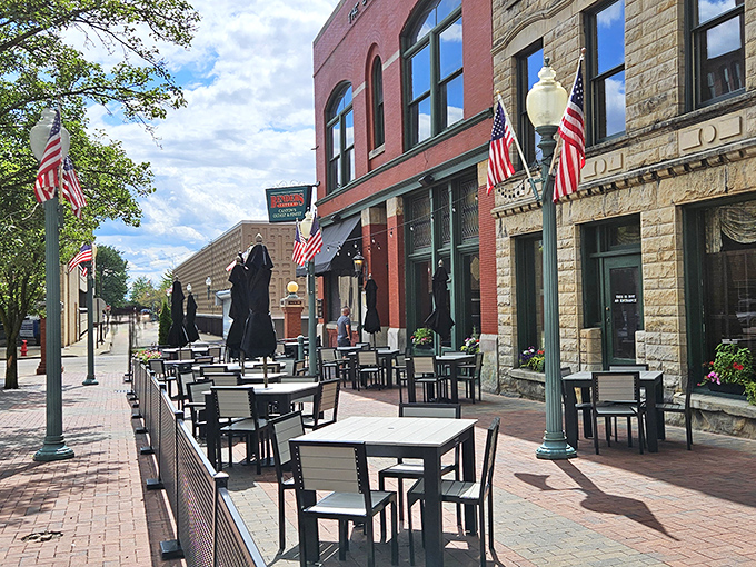 Bender's Tavern's charming brick exterior welcomes you with American flags and an inviting patio&mdash;history and hospitality standing proudly in downtown Canton.
