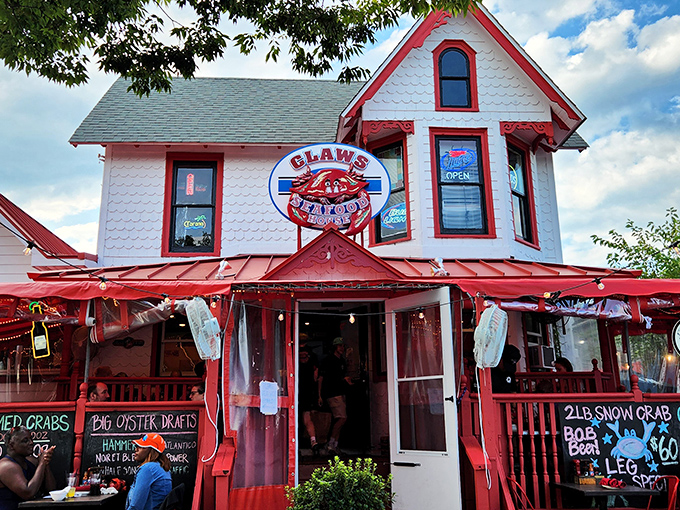 The Victorian charm of Claws Seafood House beckons seafood lovers with its distinctive white exterior and vibrant red trim. A coastal treasure hiding in plain sight.